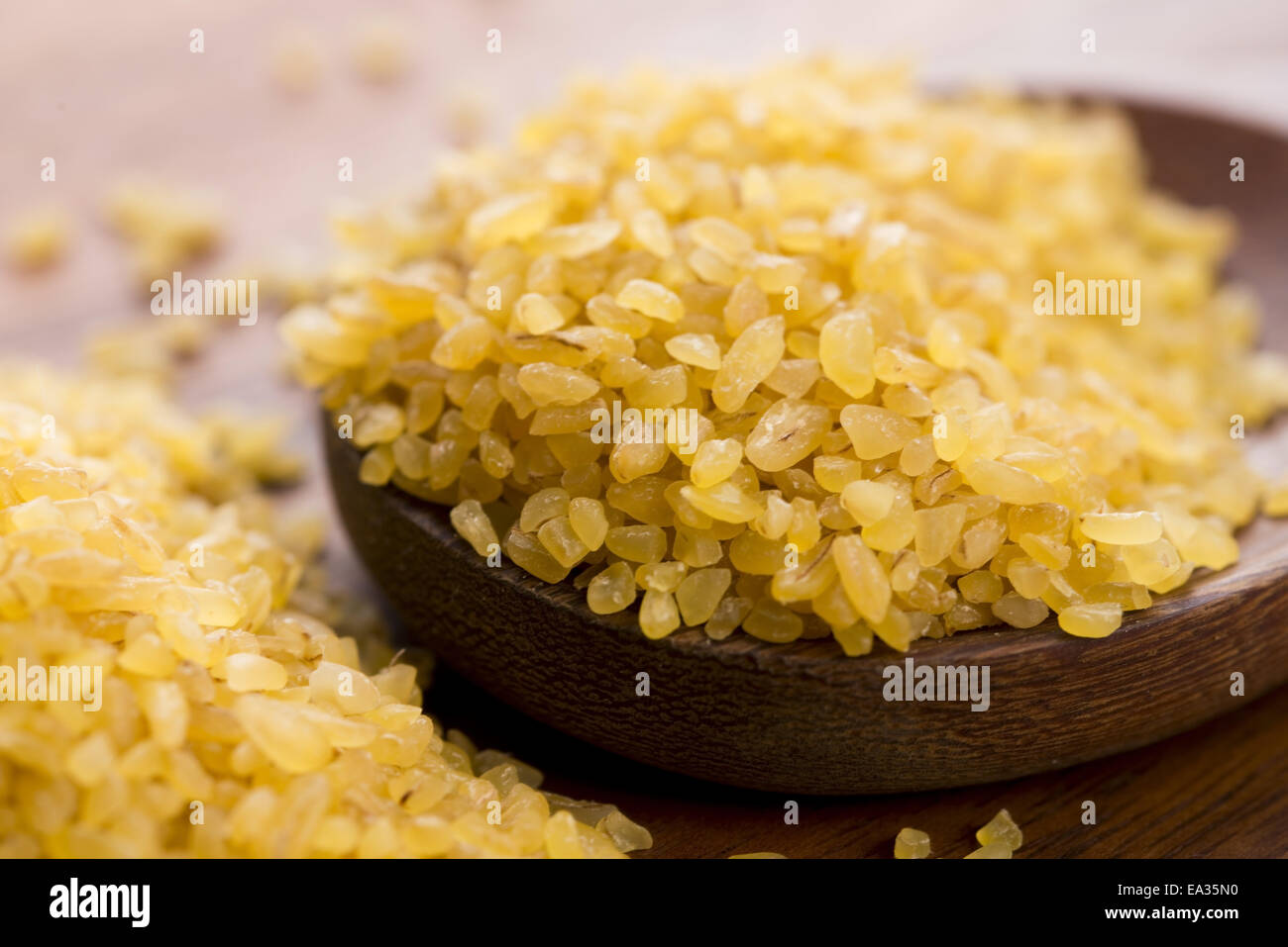 bulgur wheat in wooden spoon Stock Photo - Alamy