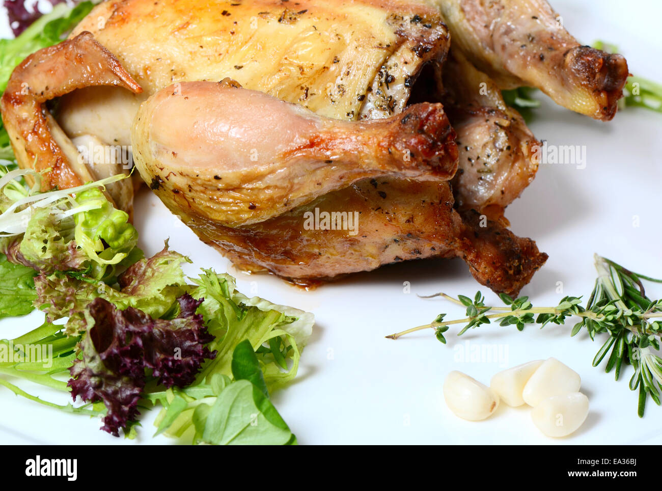 The baked hen with salad Stock Photo - Alamy