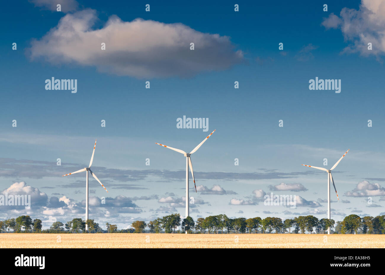 Wind turbine farm on rural terrain Stock Photo - Alamy