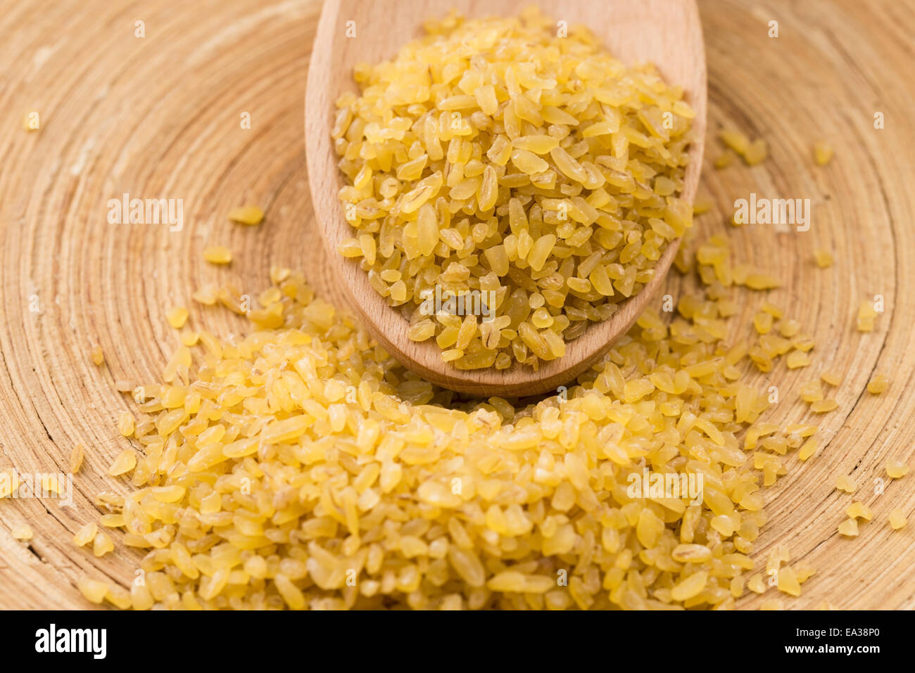 bulgur wheat in wooden spoon Stock Photo - Alamy