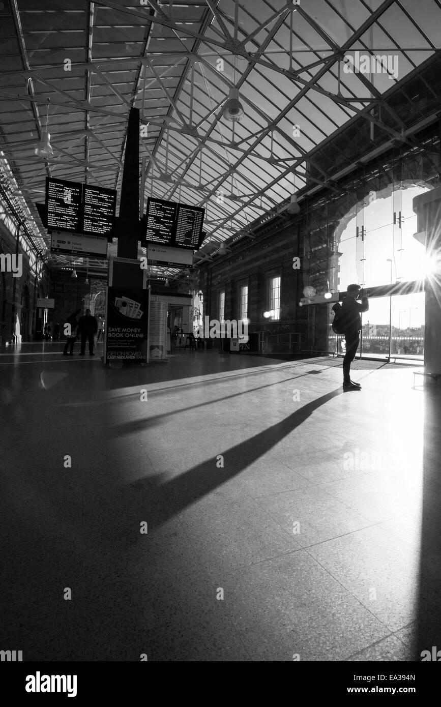 A photographer takes pictures in the shadows of the newly refurbished ...