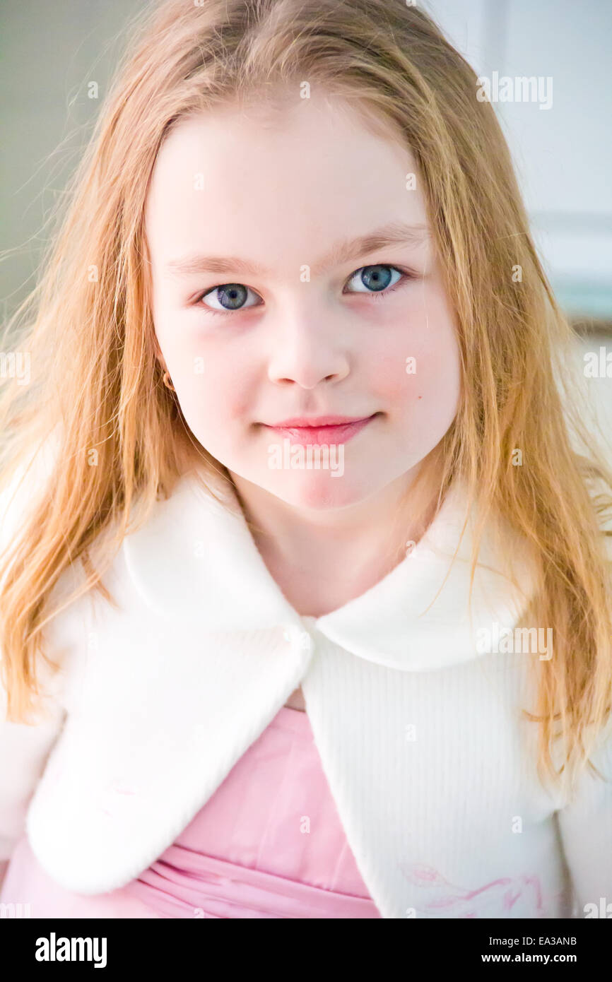 Cute girl seven years old in white Stock Photo - Alamy