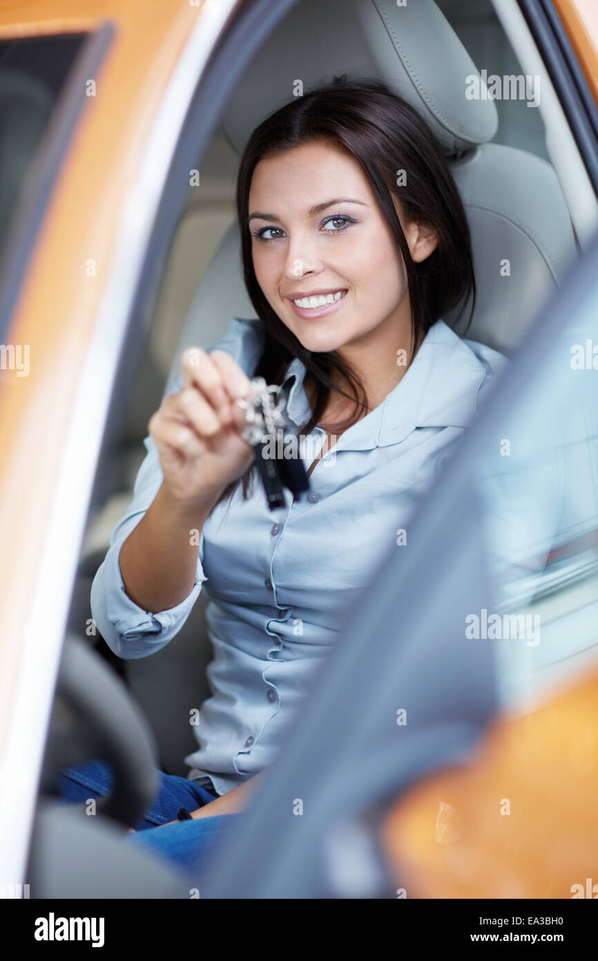 Woman with keys Stock Photo - Alamy