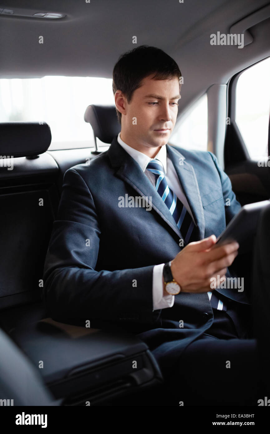 Businessman in a car Stock Photo - Alamy