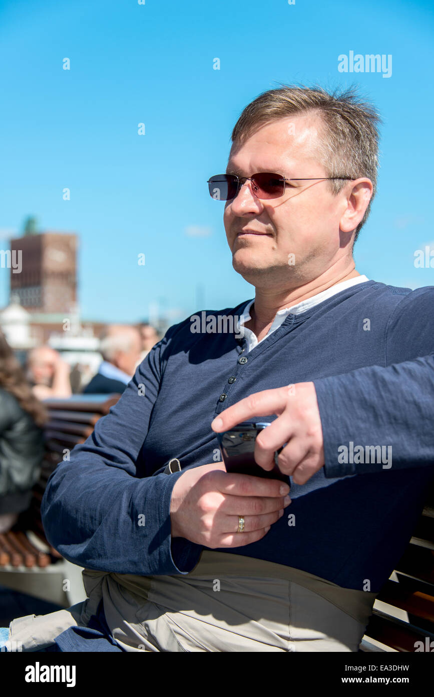 Boy relaxing on bench hi-res stock photography and images - Alamy