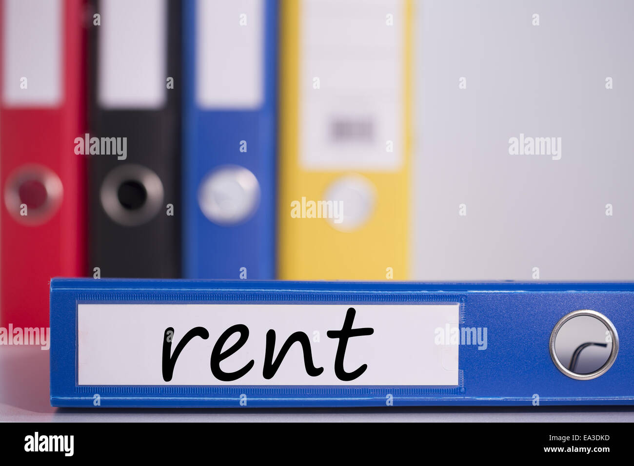 Rent on blue business binder Stock Photo - Alamy