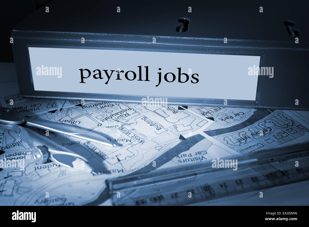 Payroll jobs on blue business binder Stock Photo - Alamy