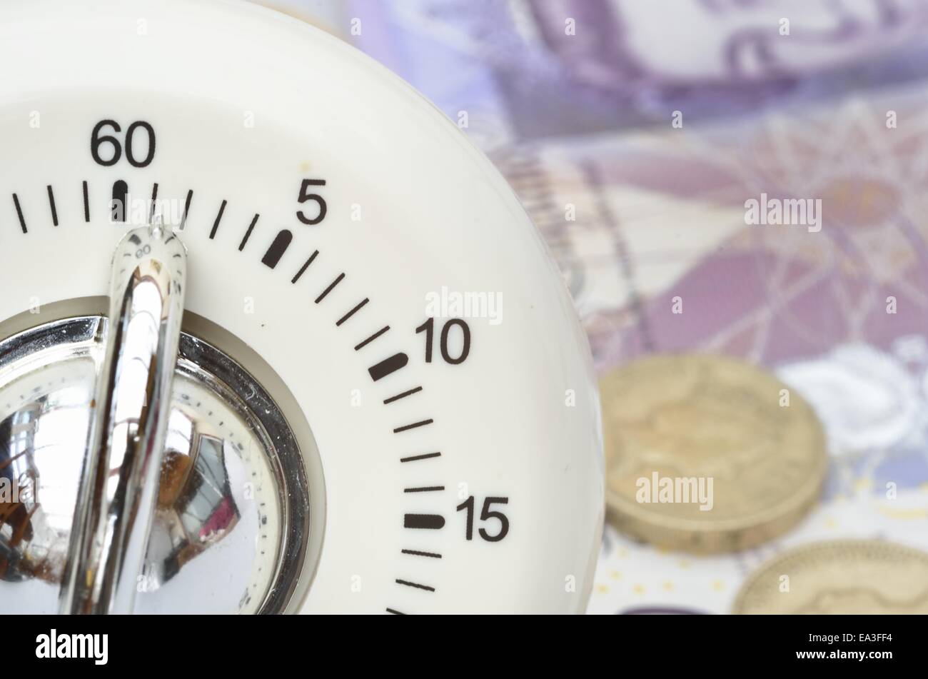 timer with cash background Stock Photo - Alamy