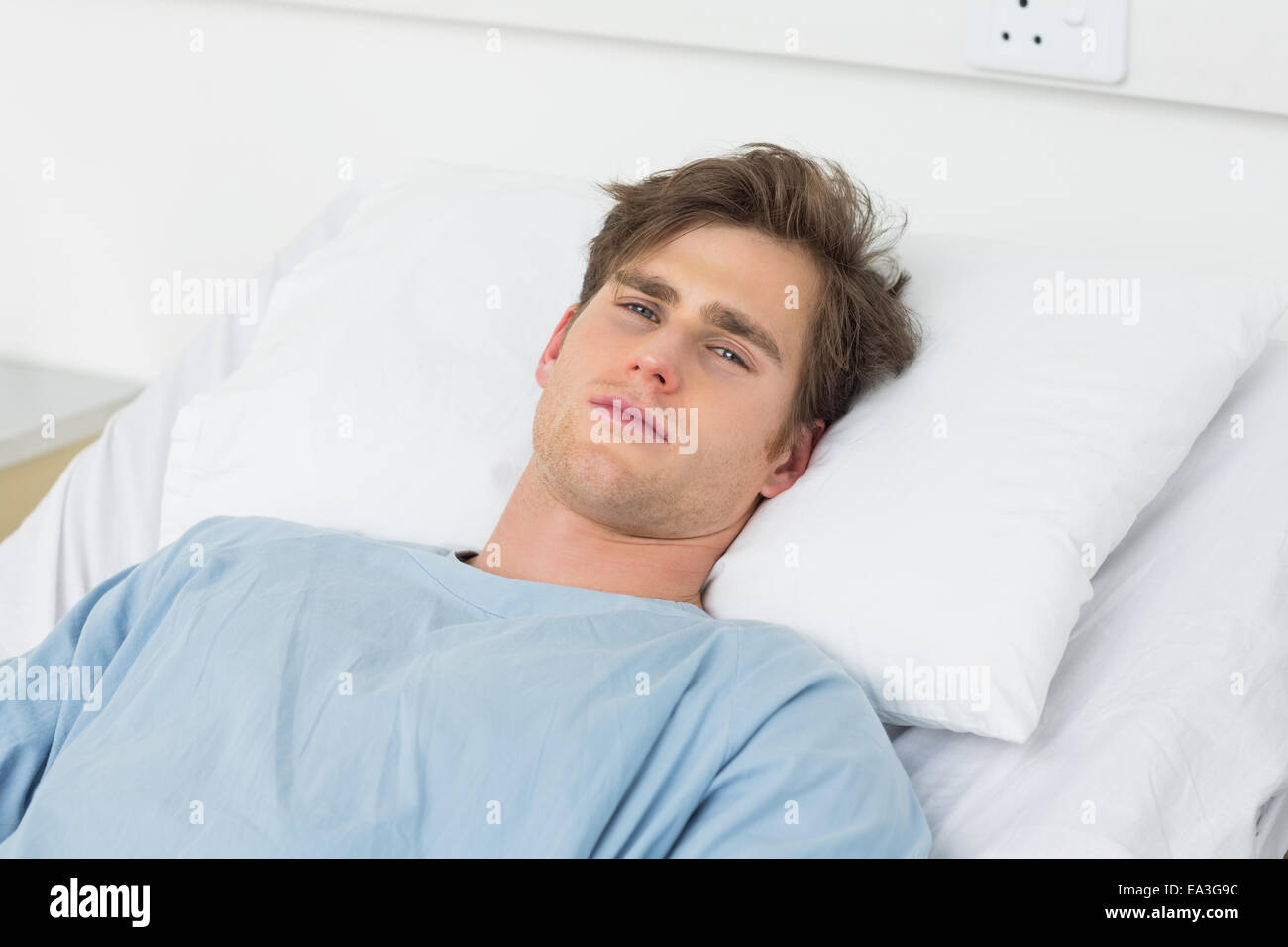Male patient relaxing on bed hi-res stock photography and images - Alamy