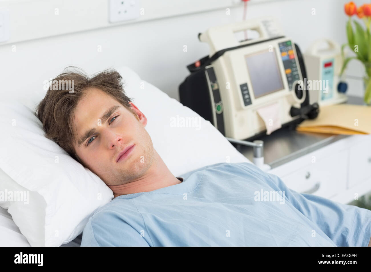Patient relaxing in hospital bed Stock Photo - Alamy