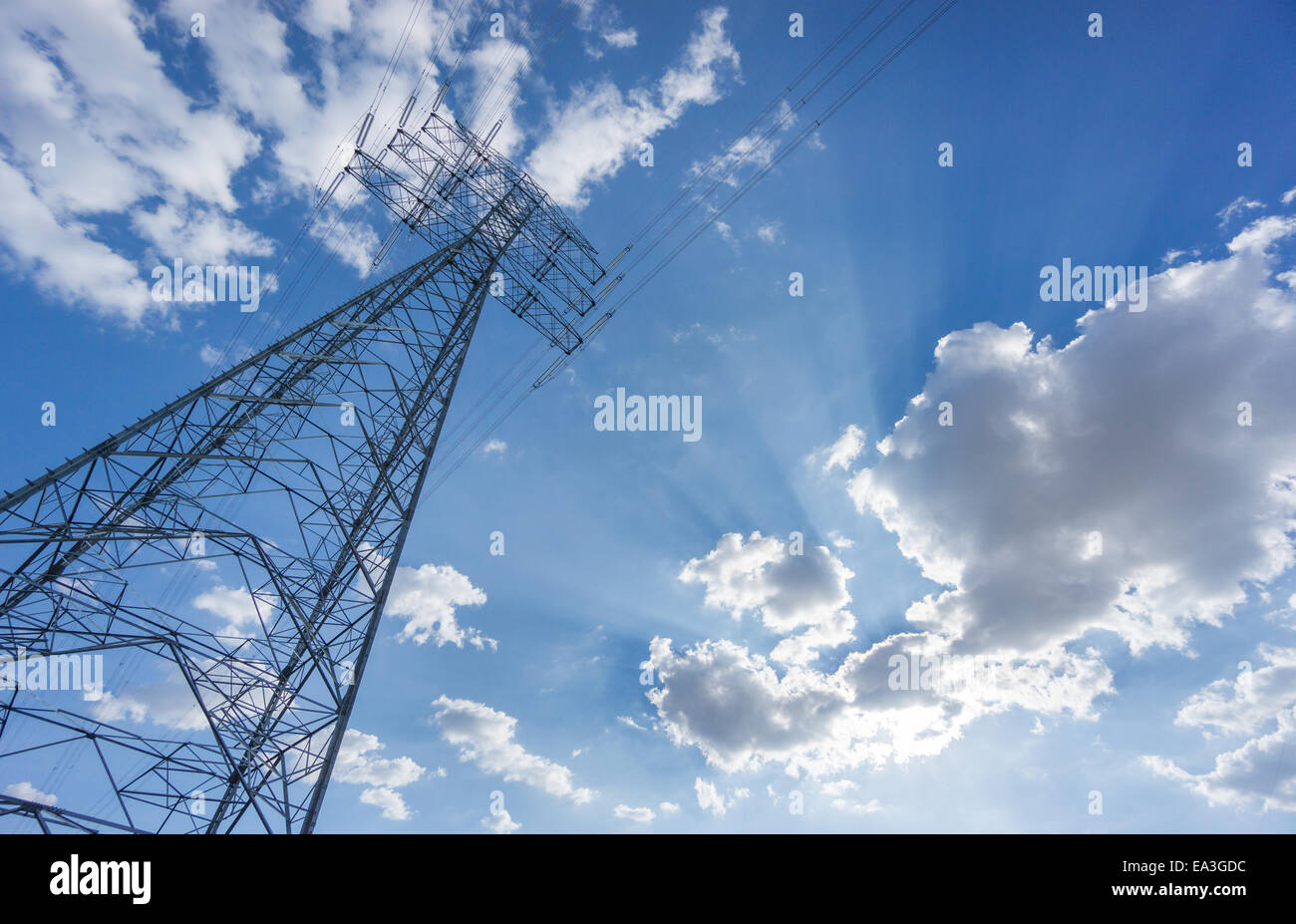 Wide view of electric tower over blue sky and clouds Stock Photo - Alamy