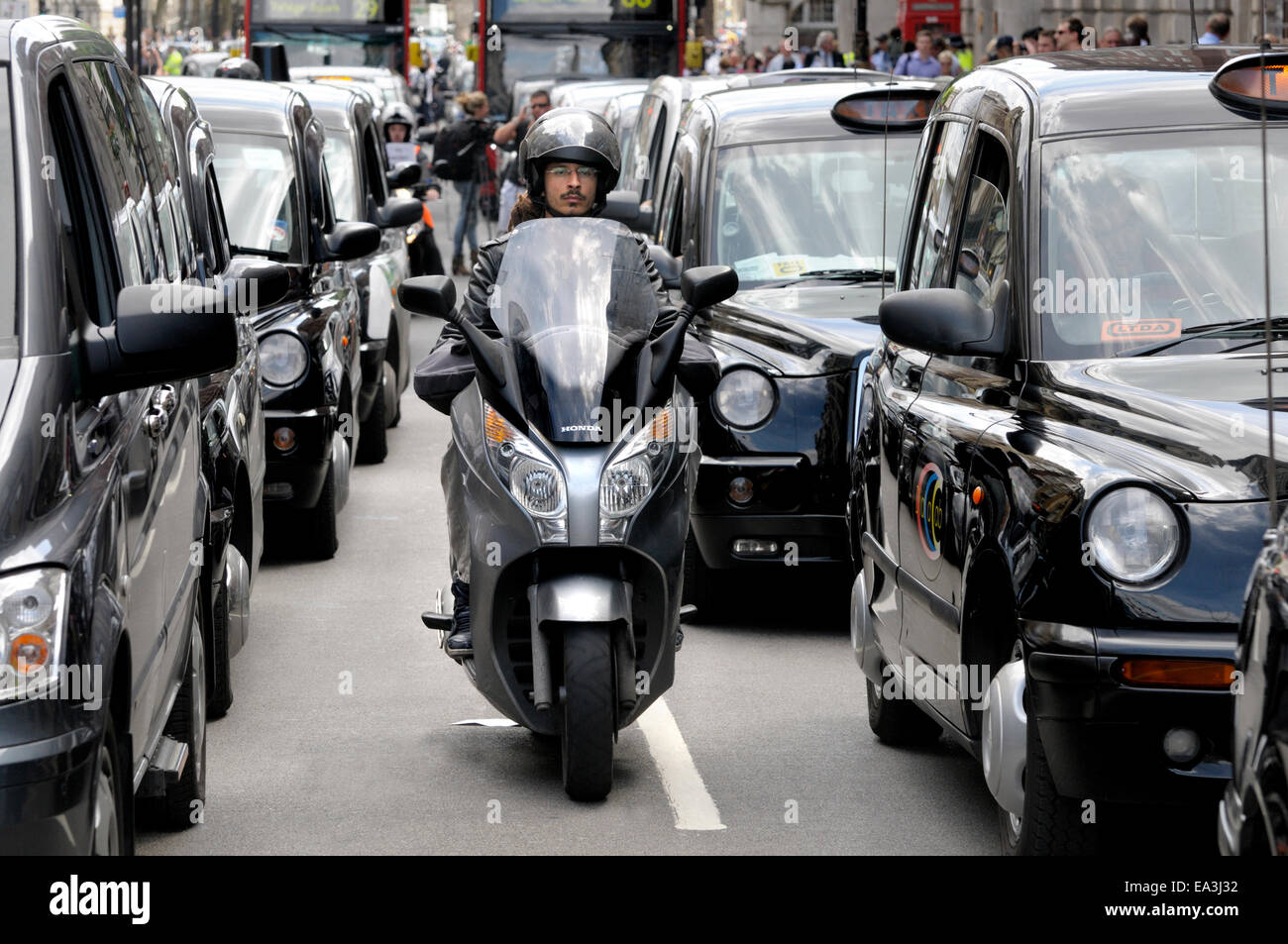 London, England, UK. Black cab drivers dispute, 2014. Morotcyclist ...