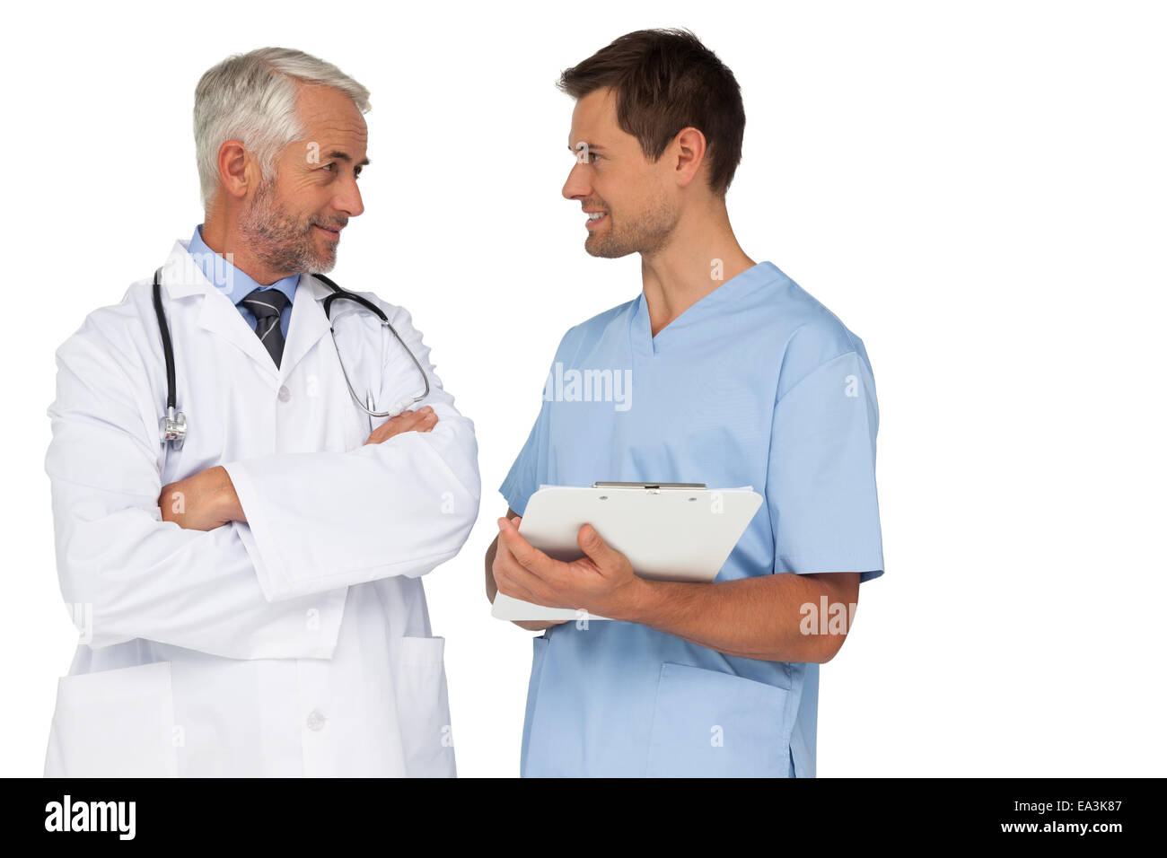 Male doctor and surgeon discussing reports Stock Photo - Alamy