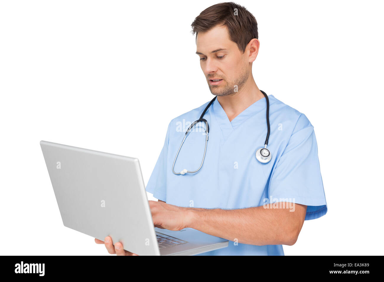 Concentrated male surgeon using laptop Stock Photo - Alamy