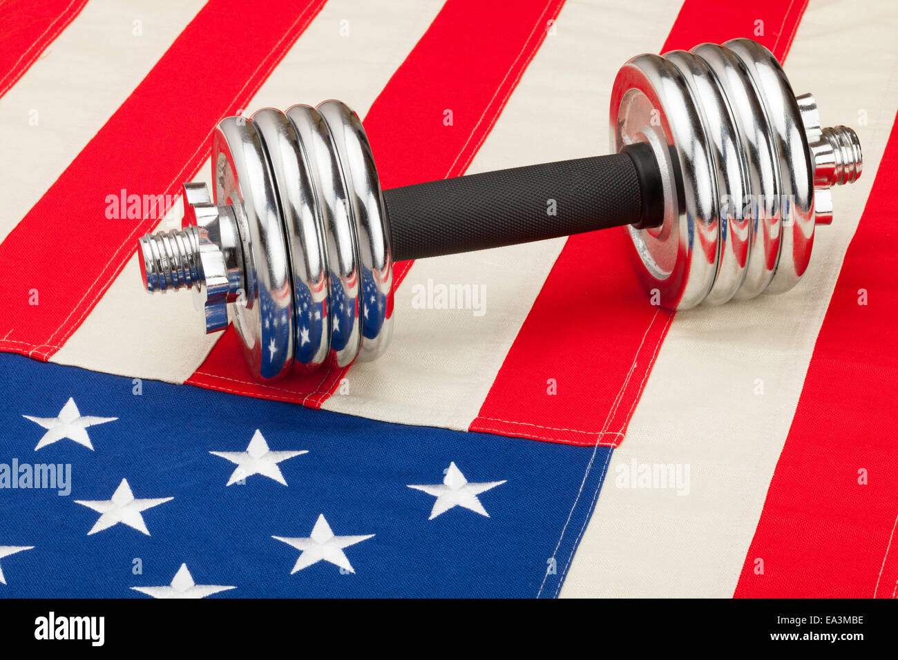 Dumbbell over US flag as symbol of healthy nation Stock Photo - Alamy