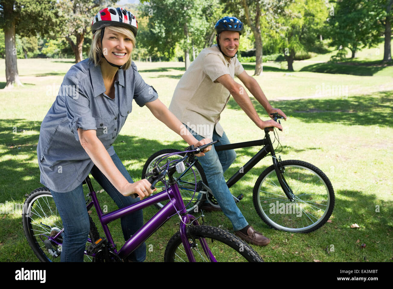 Mature couple in love cycling hi-res stock photography and images - Alamy