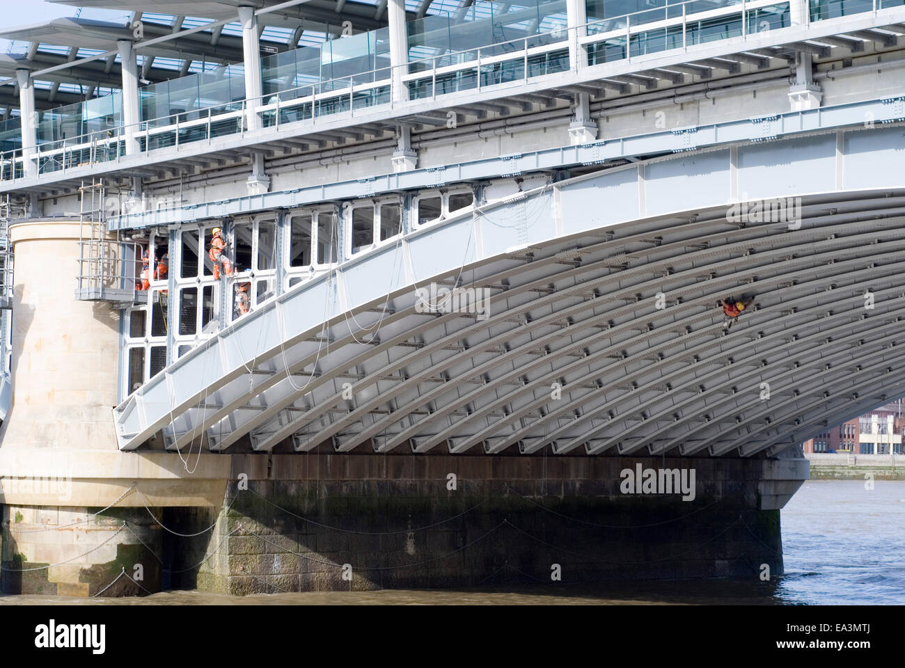 London 20 Aug 2013 : Workmen hanging alongside and beneath Blackfriars ...