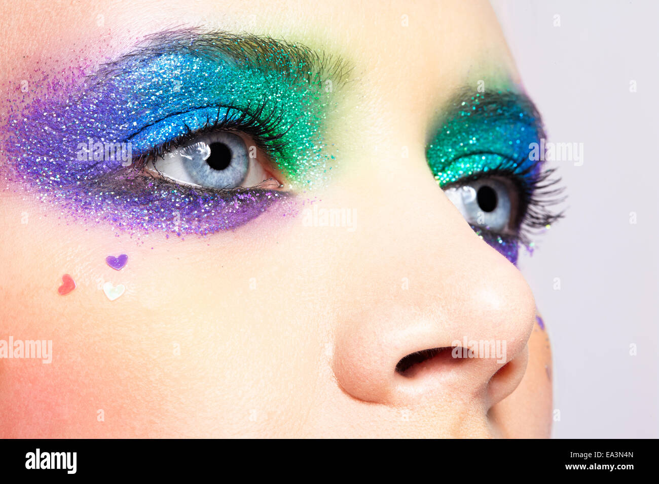 Woman eyes with shining holiday spangled makeup Stock Photo - Alamy