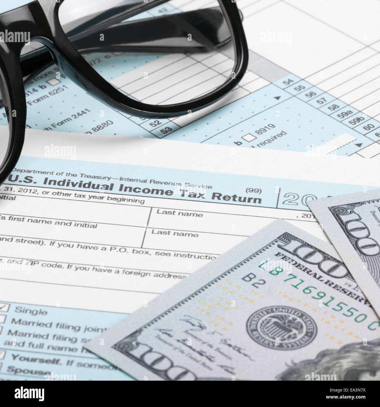 US Tax Form 1040 with dollars and glasses Stock Photo - Alamy