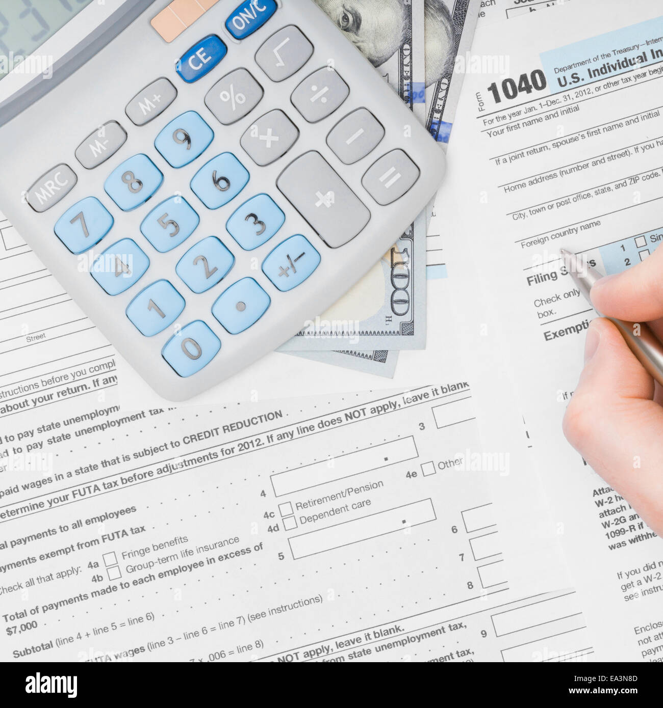 Filling out 1040 US Tax Form - view from top Stock Photo - Alamy
