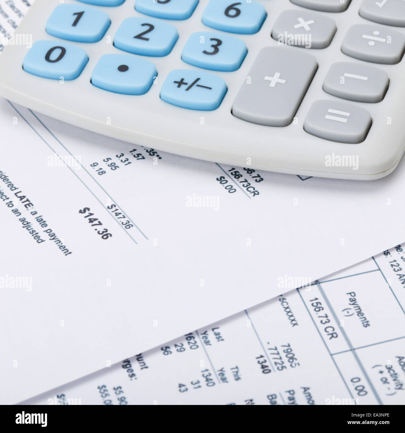Receipt next to neat calculator Stock Photo - Alamy