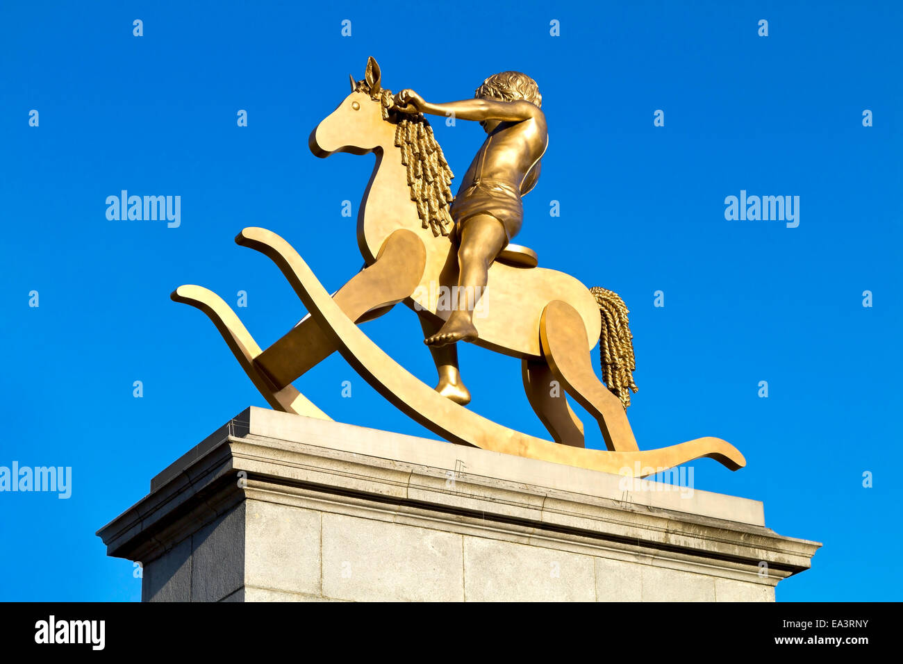 Golden statue of young child on rocking horse on 4th plinth Trafalgar ...
