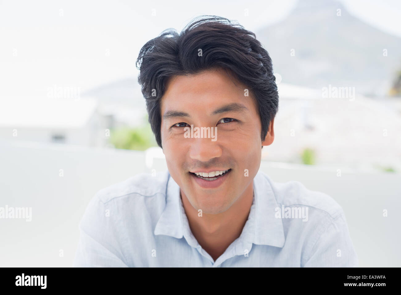 Smiling man looking at camera Stock Photo - Alamy