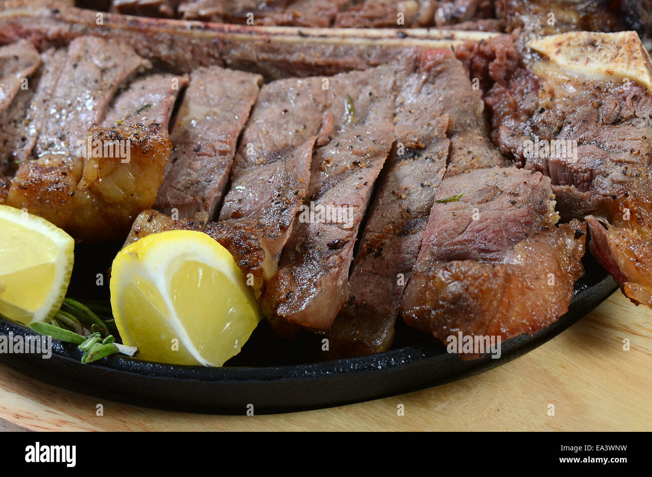 Stake from mutton with a lemon Stock Photo - Alamy