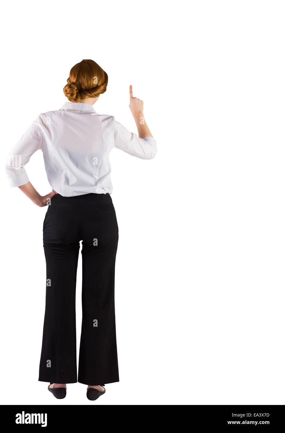 Redhead businesswoman standing and pointing Stock Photo - Alamy