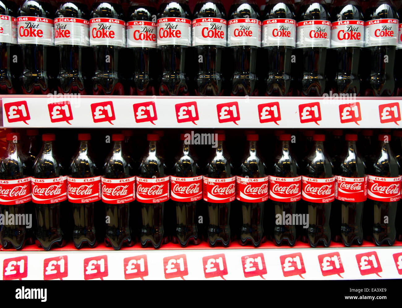 Coca cola coke bottles on display in a supermarket shop for £1 Stock ...