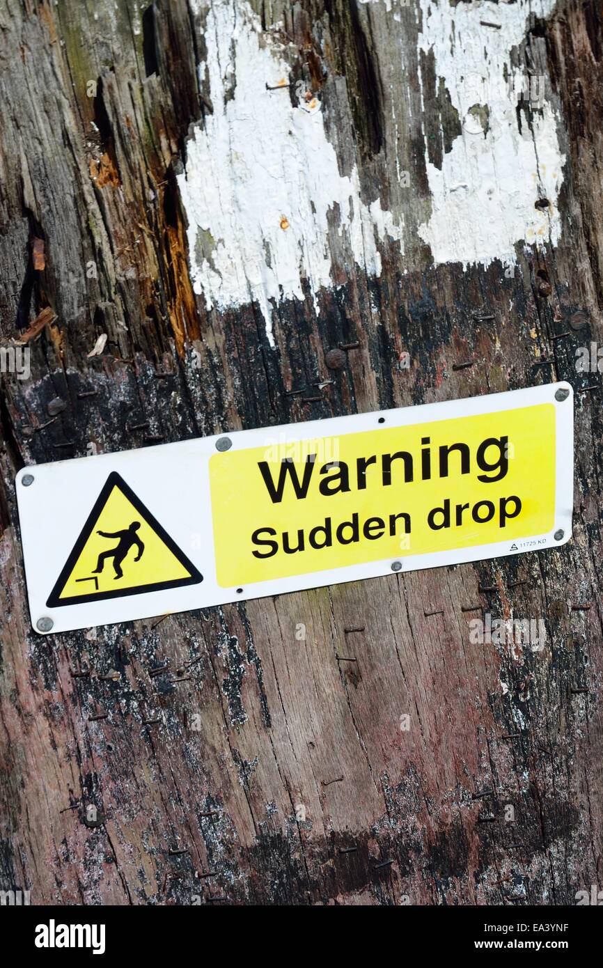 Warning sign for sudden drop Stock Photo - Alamy