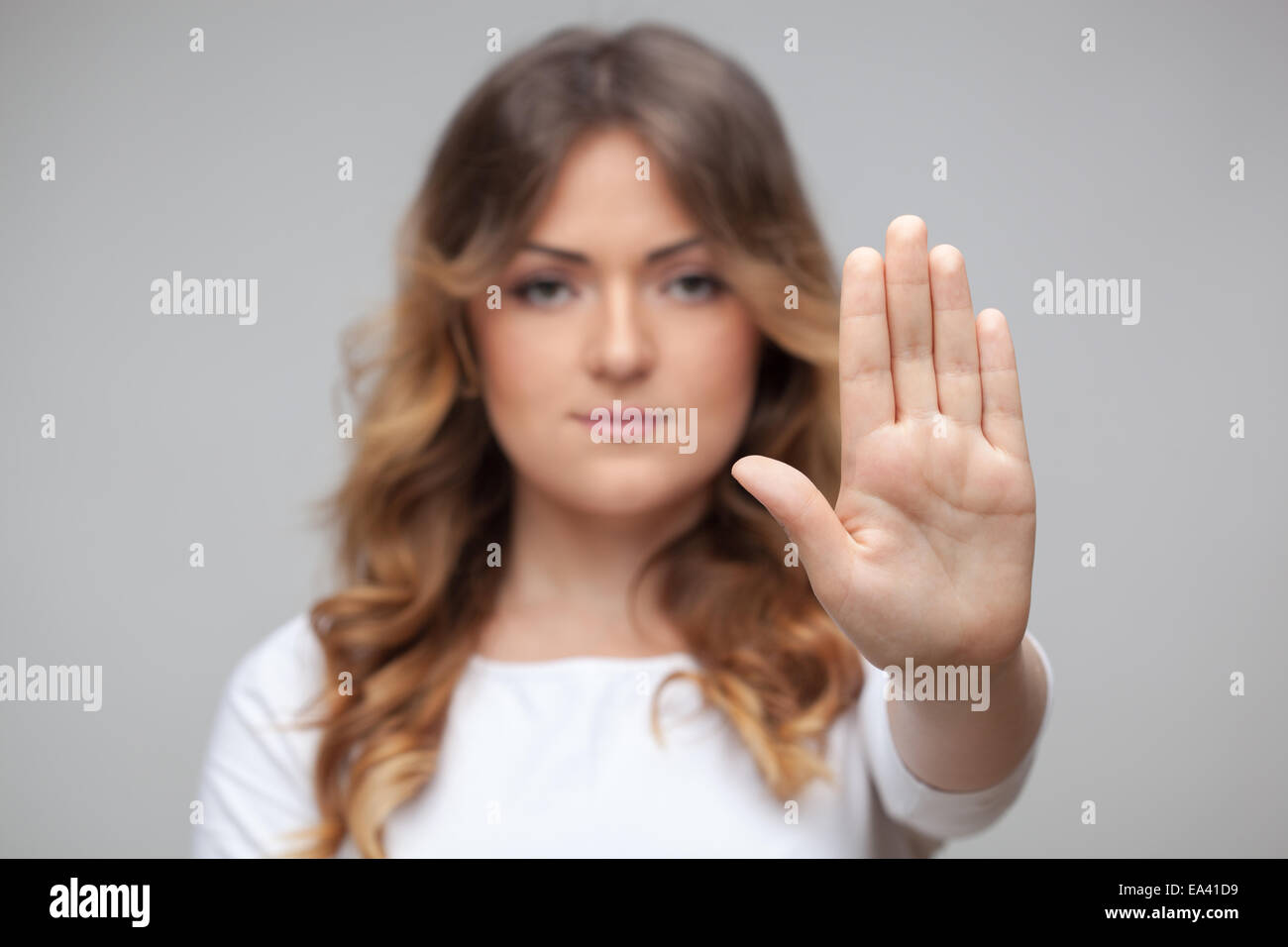 female hand stop sign isolated on white Stock Photo - Alamy