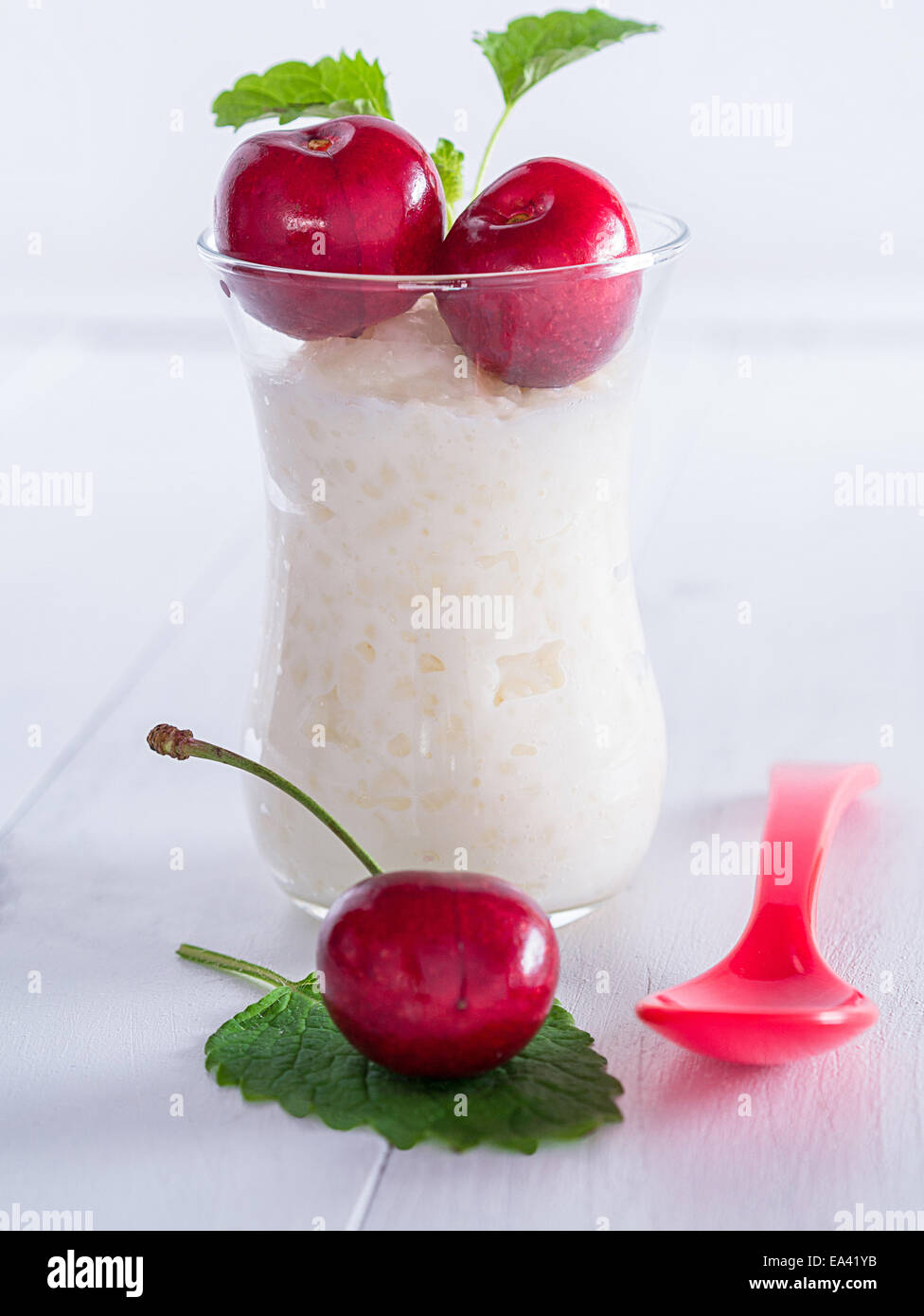 Rice pudding with cherries Stock Photo - Alamy