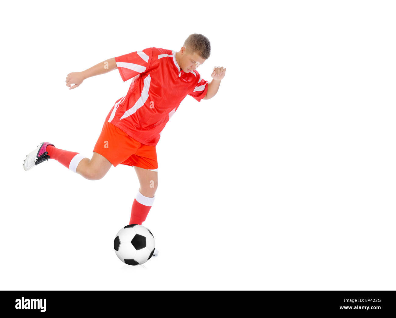 Boy playing football pass Cut Out Stock Images & Pictures - Alamy