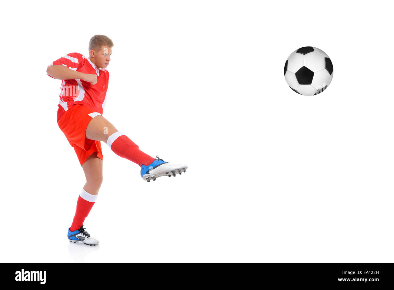 Boy playing football pass Cut Out Stock Images & Pictures - Alamy