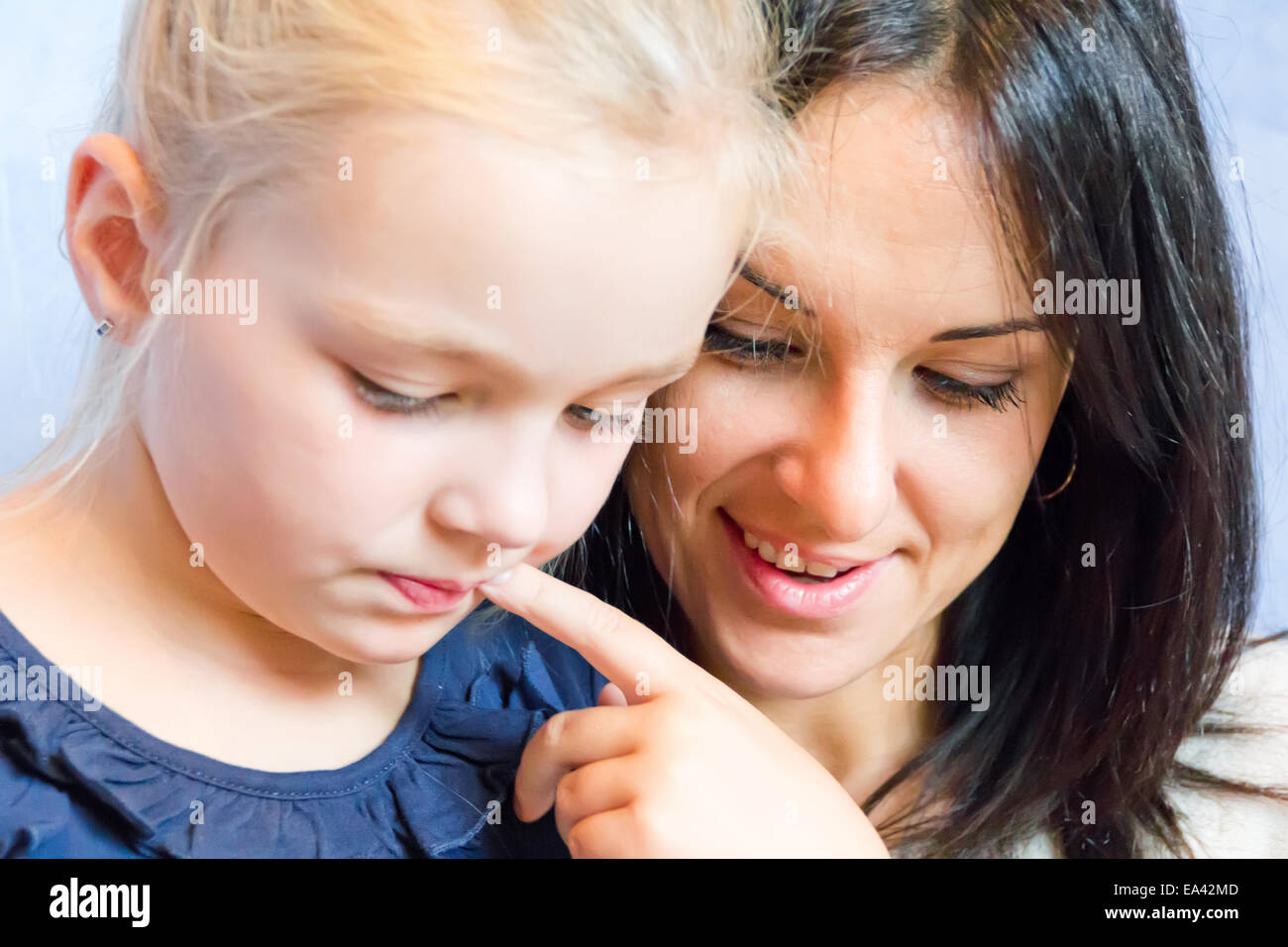 Thinking mother and daughter Stock Photo - Alamy