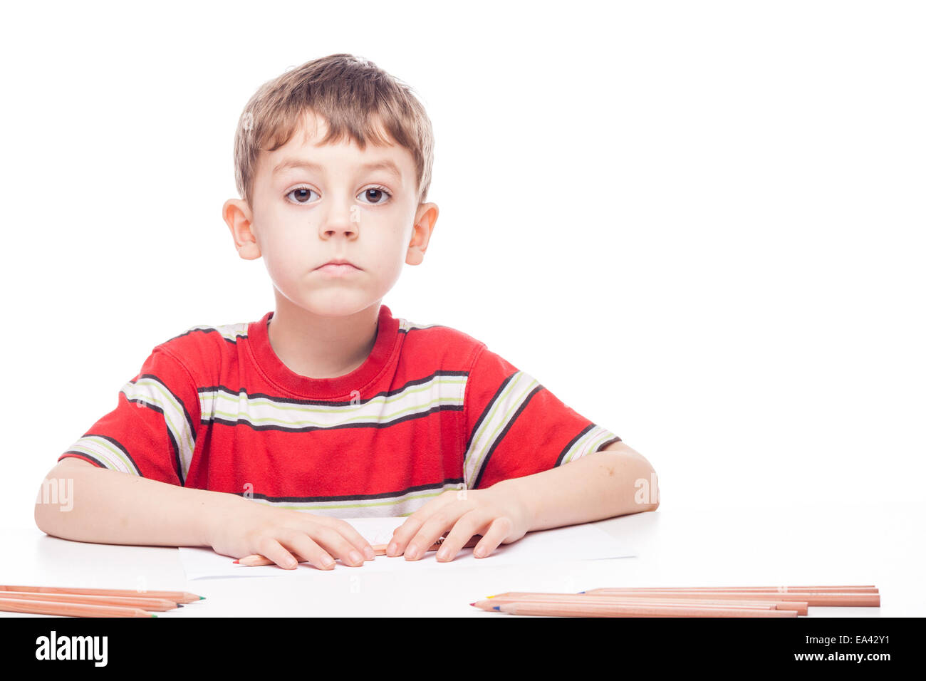 Boy at table Stock Photo - Alamy