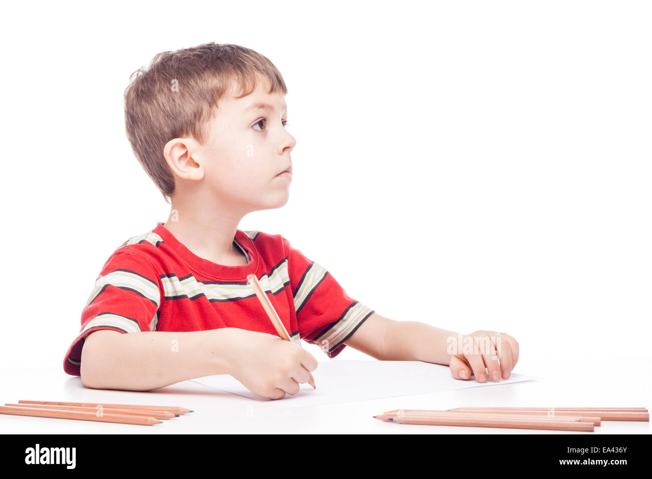 Boy at table Stock Photo - Alamy