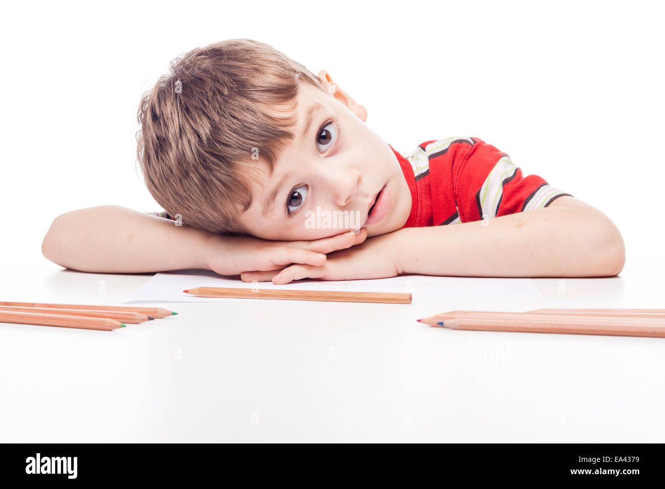 Boy at table Stock Photo - Alamy