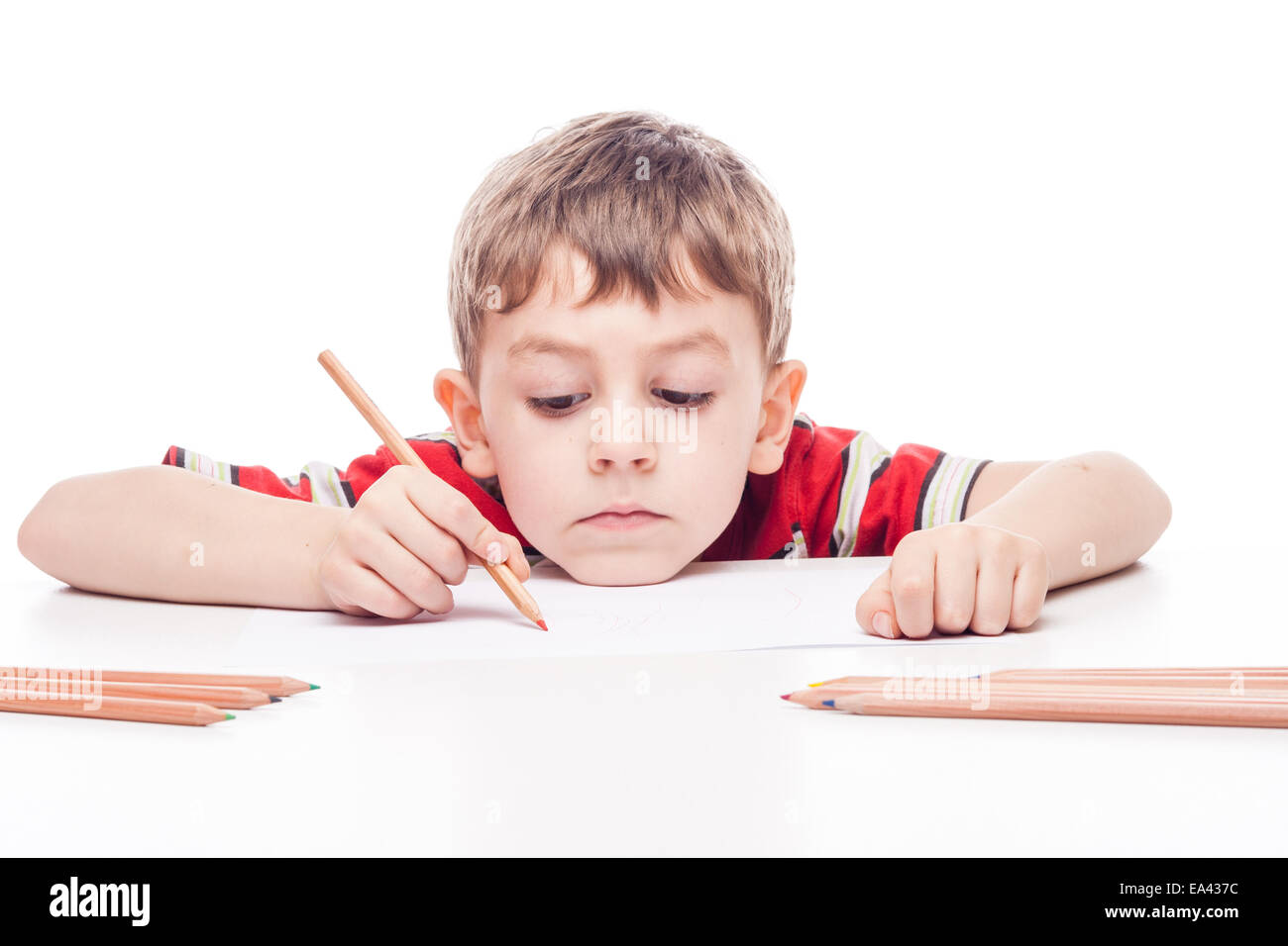 Boy at table Stock Photo - Alamy