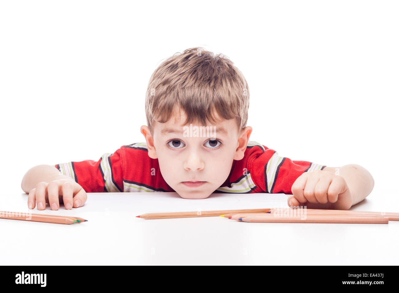 Boy at table Stock Photo - Alamy