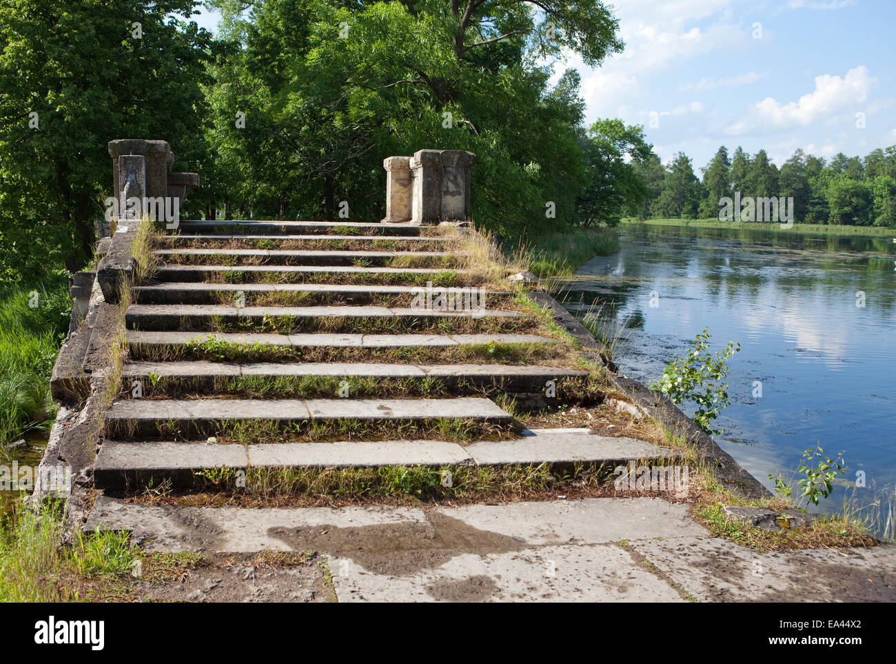 The old destroyed bridge in park Stock Photo - Alamy