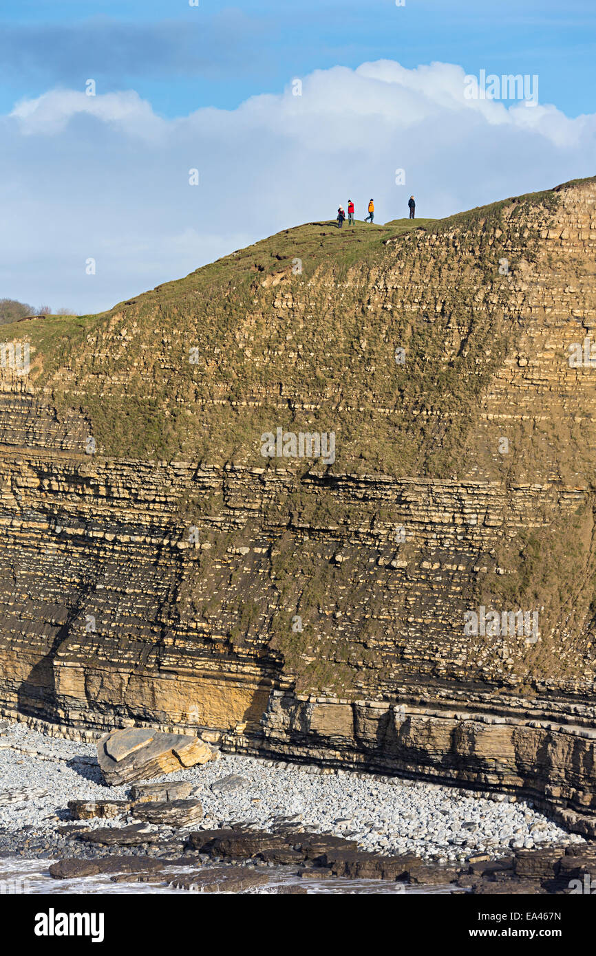 People walking on cliff edge path, Dunraven, Glamorgan, Wales, UK Stock ...