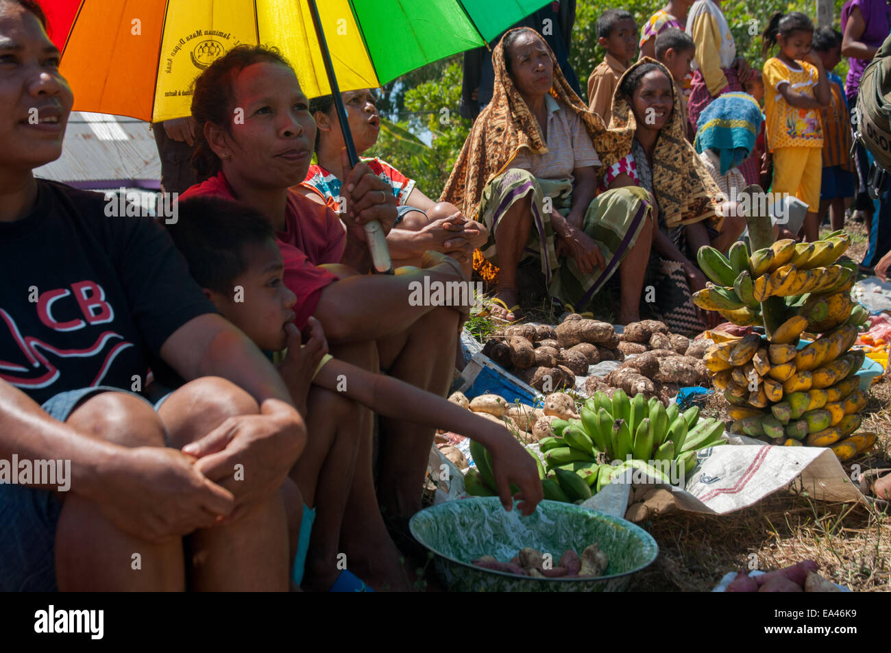 Women with their vegetables and fruits to trade at a barter market in ...