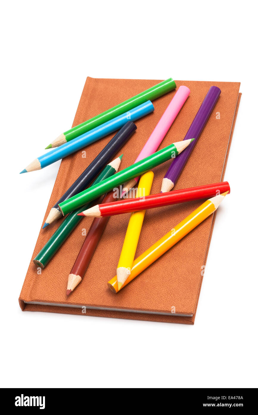 pencils and notebook Stock Photo - Alamy