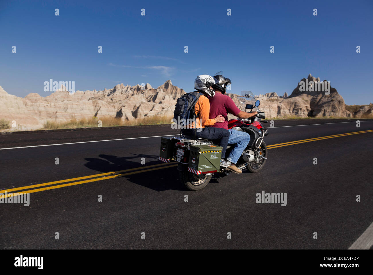 Couple Riding Motorcycle in Badlands National Park, South Dakota, USA ...