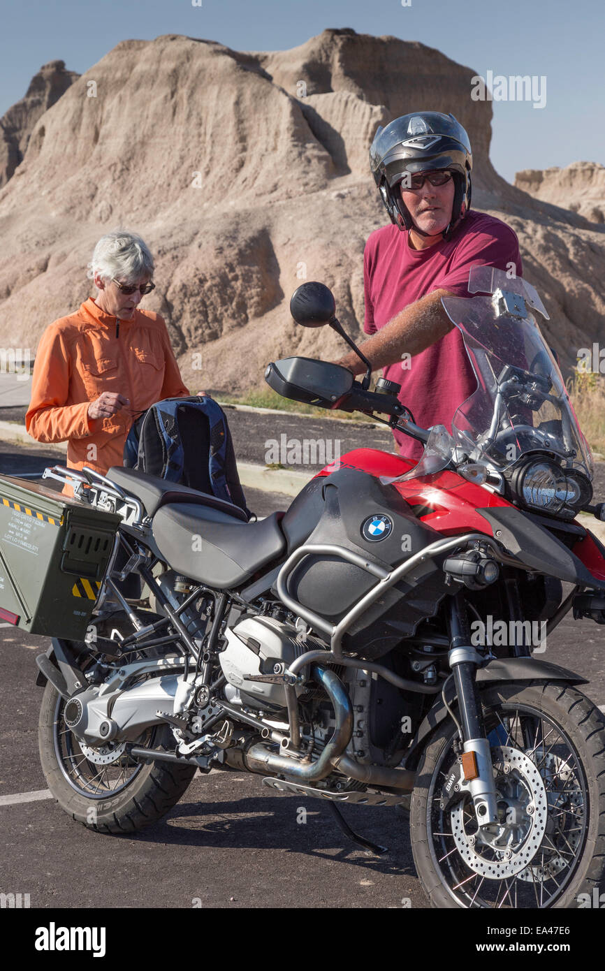 Couple Riding Motorcycle in Badlands National Park, South Dakota, USA ...
