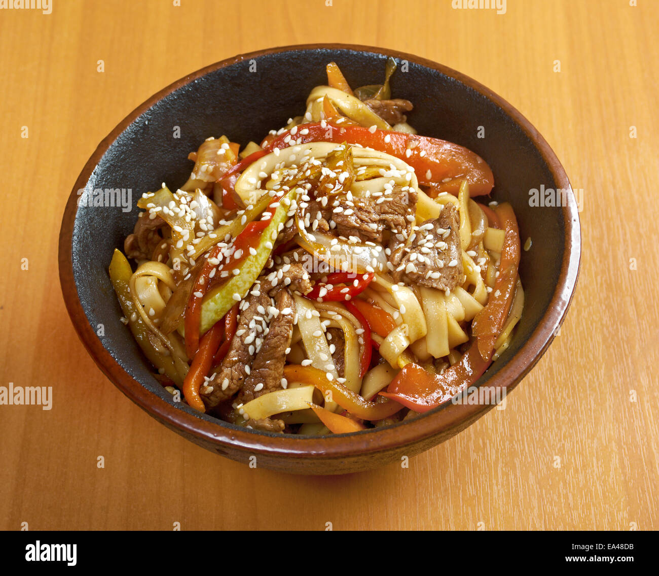 Cooking udon teppanyaki with pork Stock Photo - Alamy