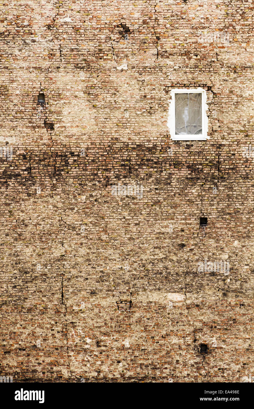 brick wall with little window Stock Photo - Alamy