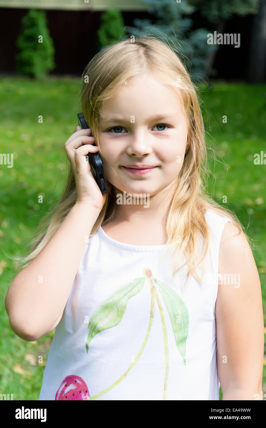 Cute girl talking by cellular Stock Photo - Alamy